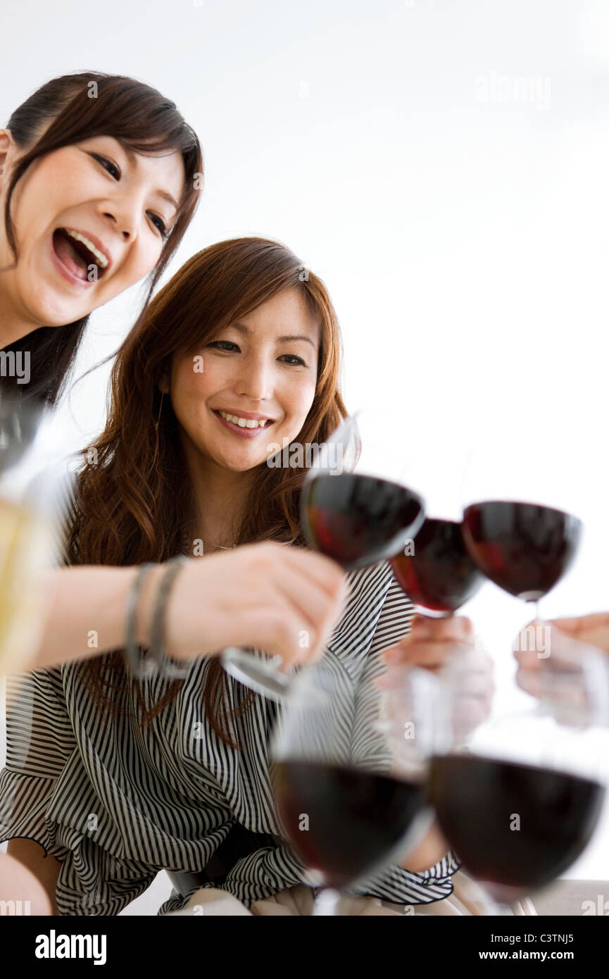Women Toasting With Red Wine Stock Photo - Alamy