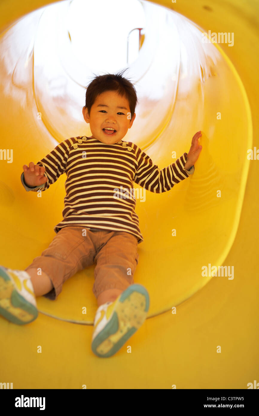 Boy on Slide Stock Photo - Alamy