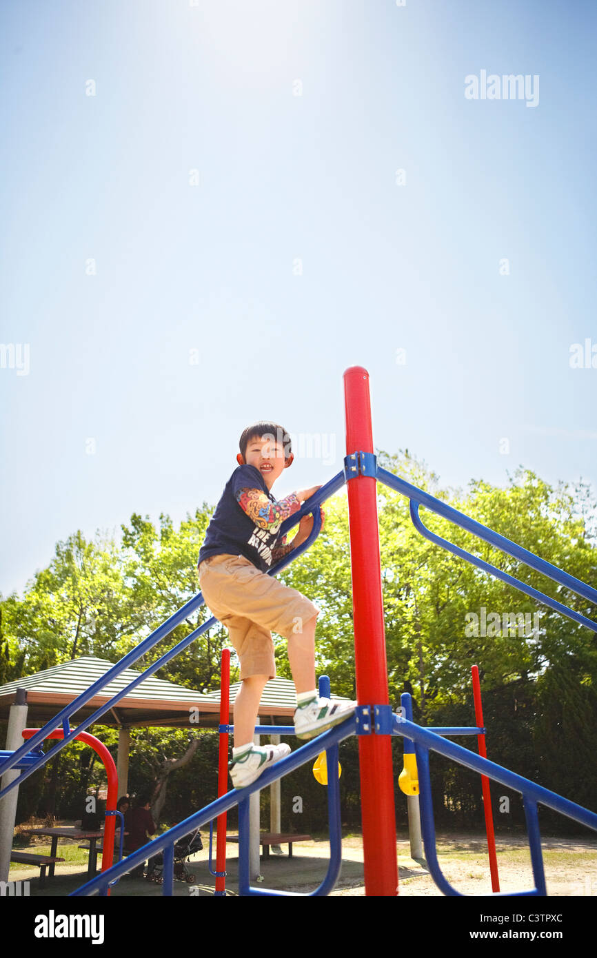 Boy Playing in Playground Stock Photo - Alamy