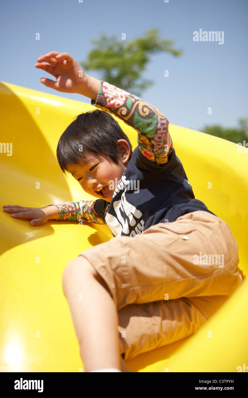 Boy on Slide Stock Photo - Alamy