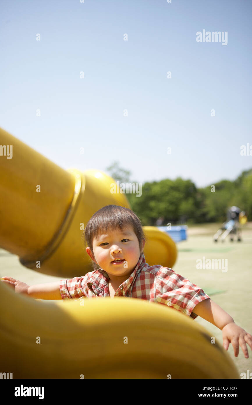 Baby Boy on Slide Stock Photo - Alamy