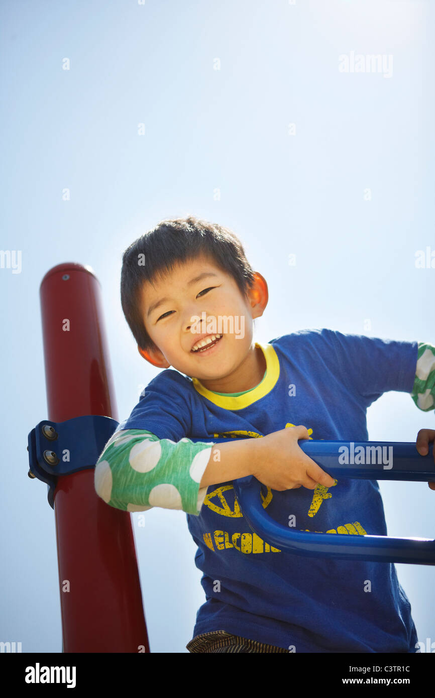 Boy Playing in Playground Stock Photo - Alamy