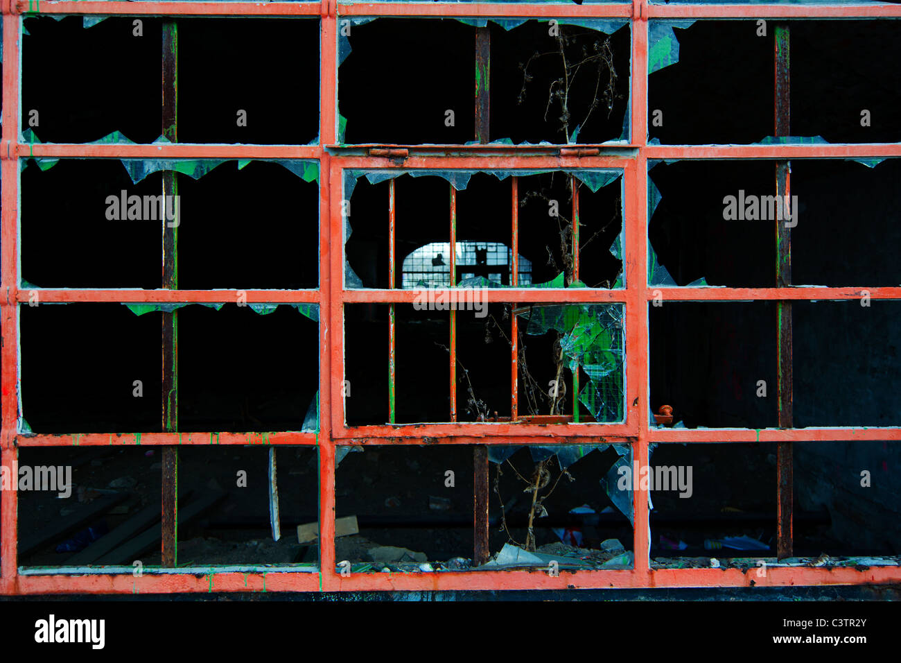 Old broken steel red painted frame window Stock Photo - Alamy