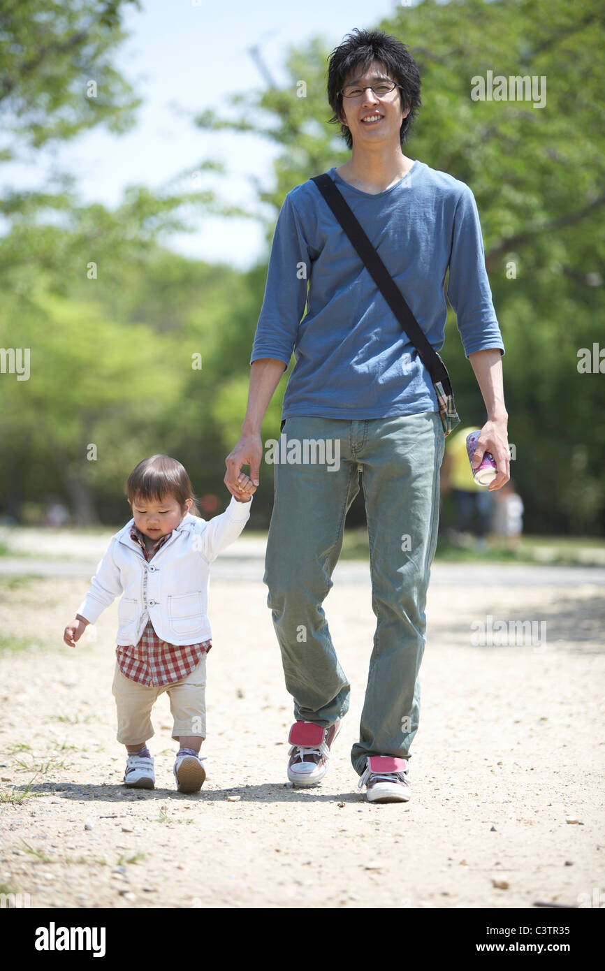 Father and Baby Boy Walking Stock Photo - Alamy