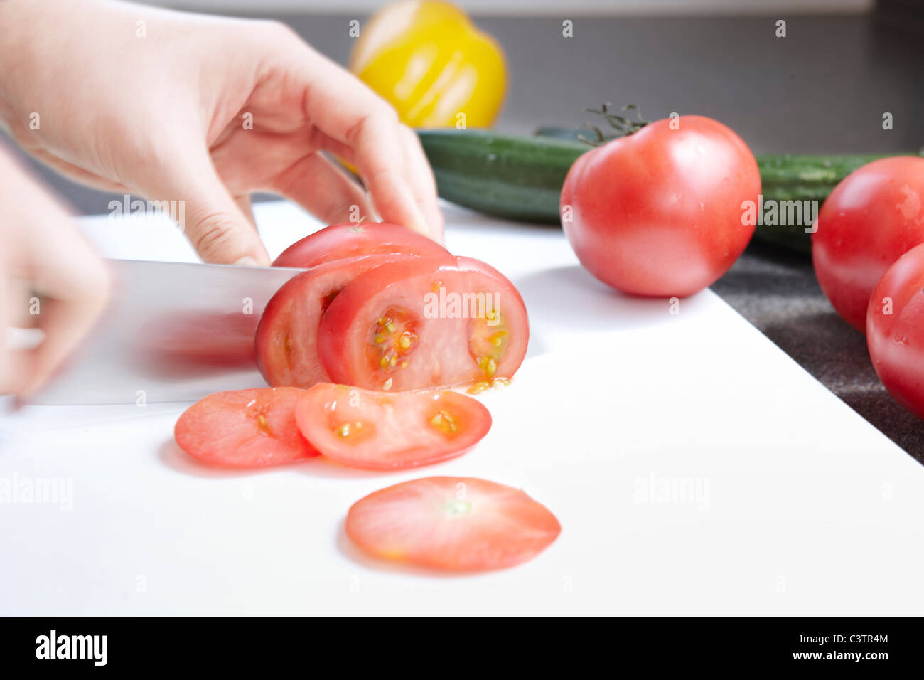 Human Hand Chopping Tomato Stock Photo - Alamy