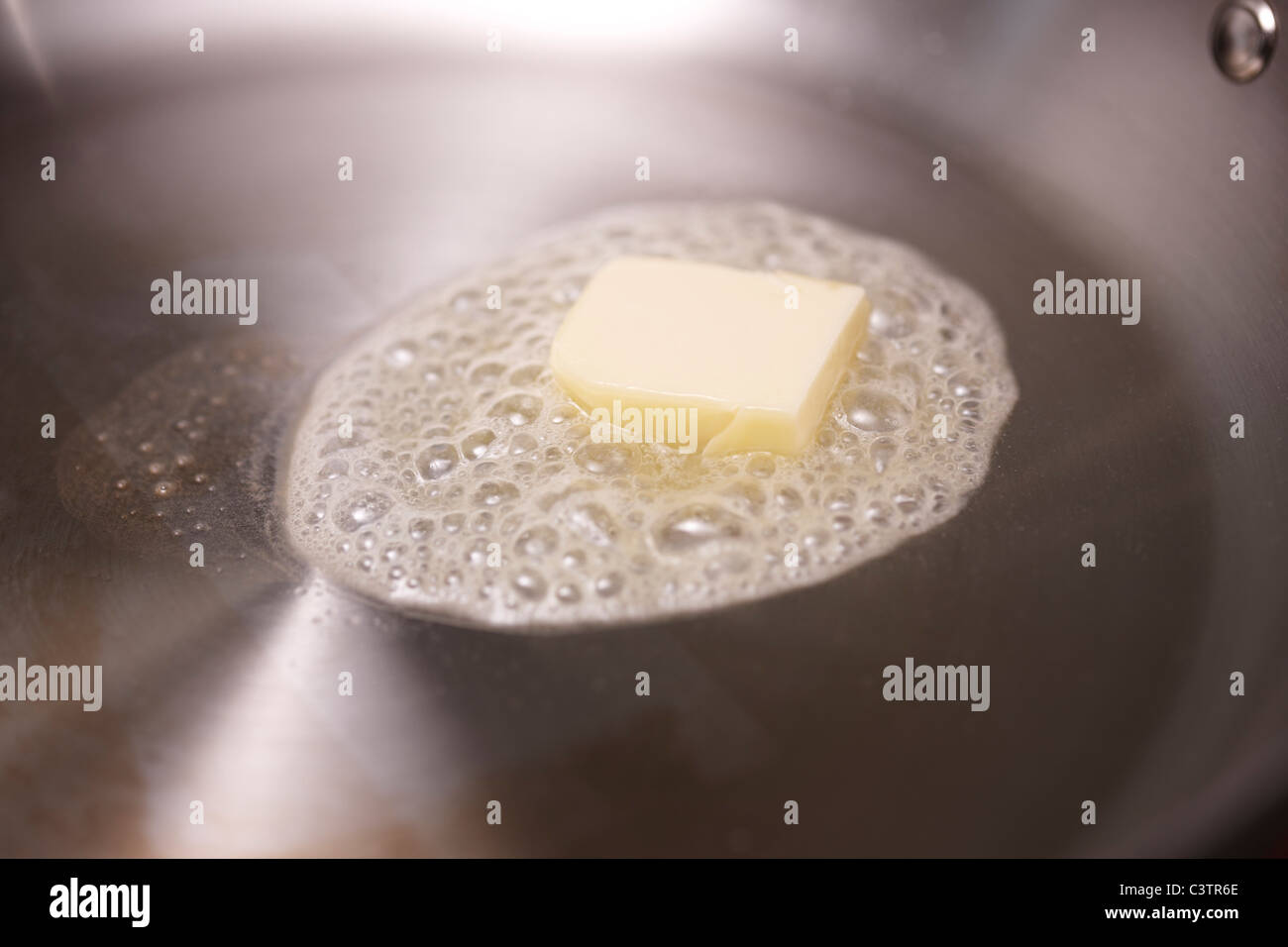 Butter Melting in Pan Stock Photo - Alamy