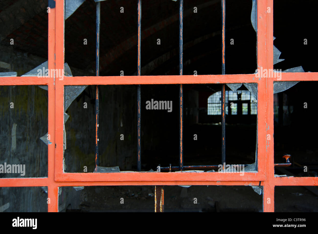Old broken steel red painted frame window Stock Photo - Alamy