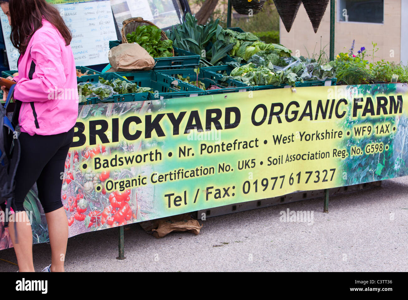 An organic farm stall selling organic vegetables at a market in ...