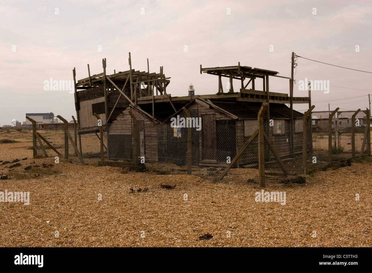 Derelict building on shingle at Dungeness, Kent, UK Stock Photo - Alamy