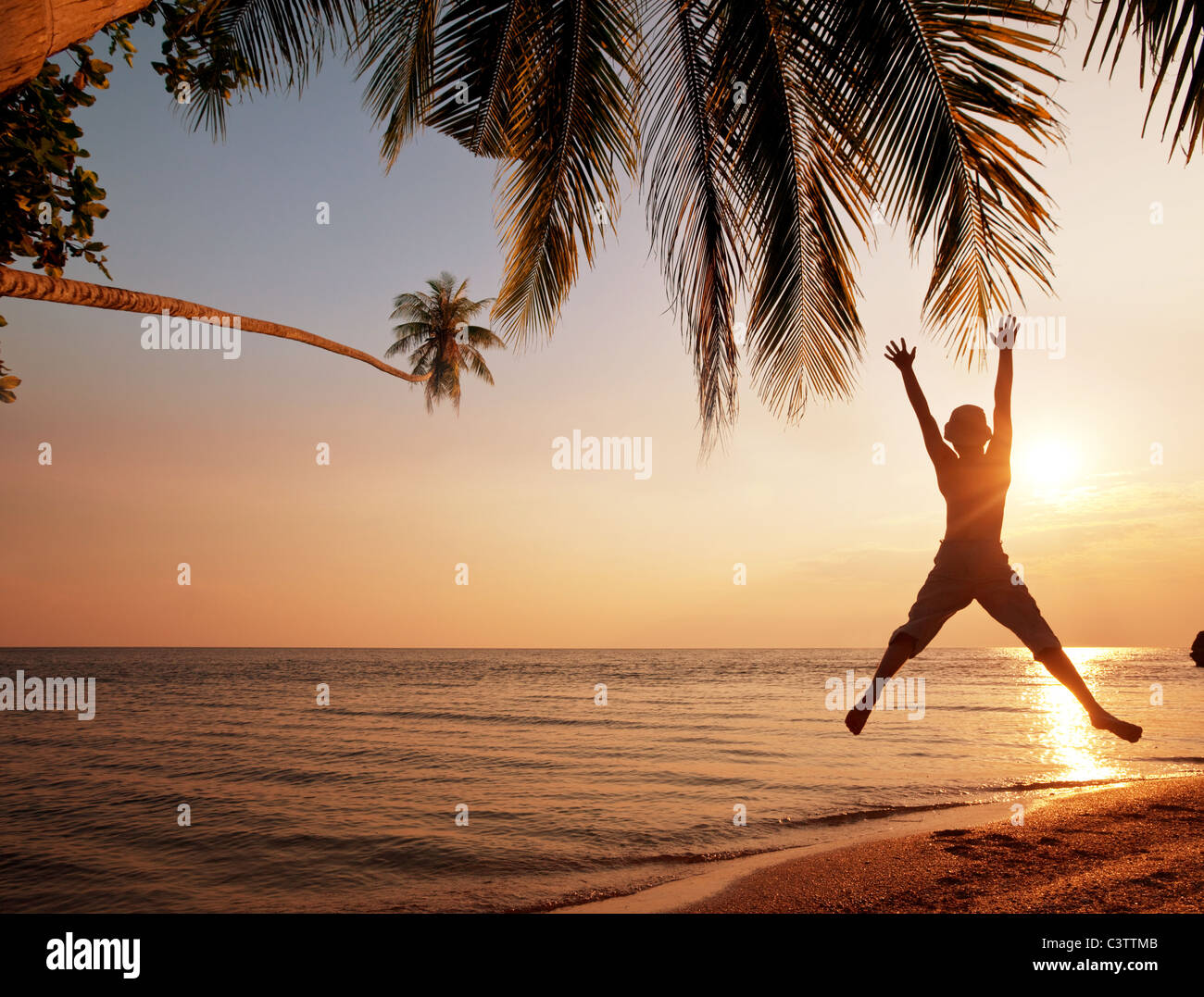 boy jumping on the beach Stock Photo - Alamy