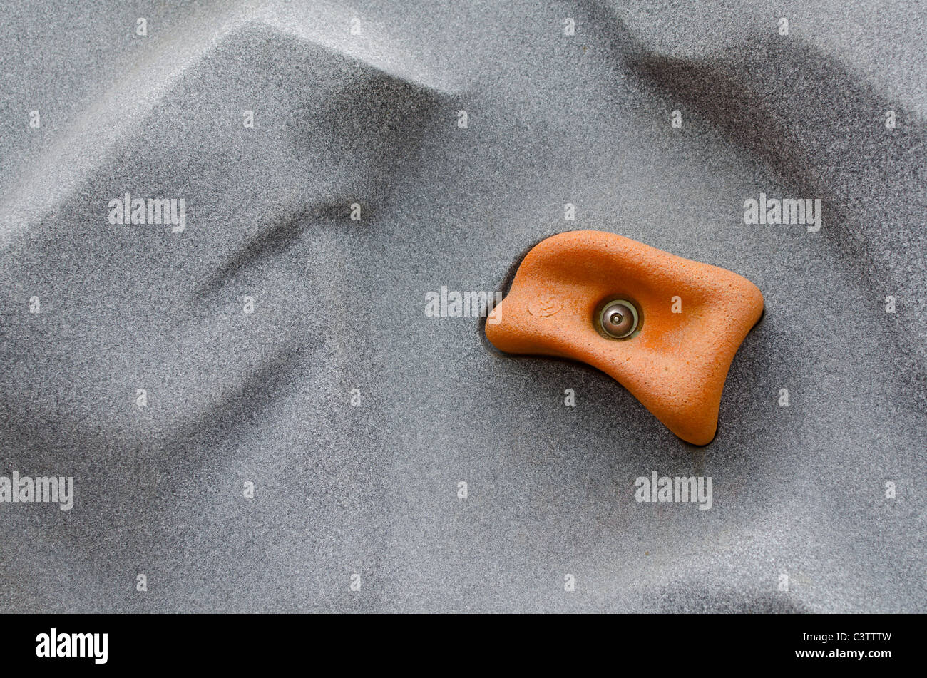 Hand grip on climbing wall Stock Photo - Alamy