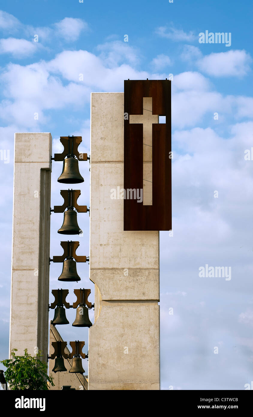 Seven bells in vertical of a church with a cross Stock Photo - Alamy