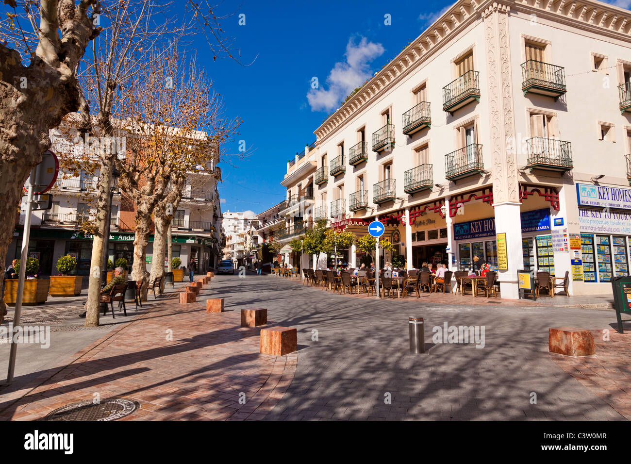 Main street in the picturesque village of Nerja, Malaga Province ...