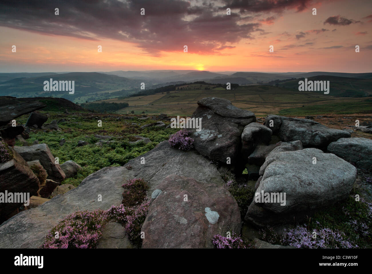Sunset over the rocky landscape of the Peak District as seen near Owler ...