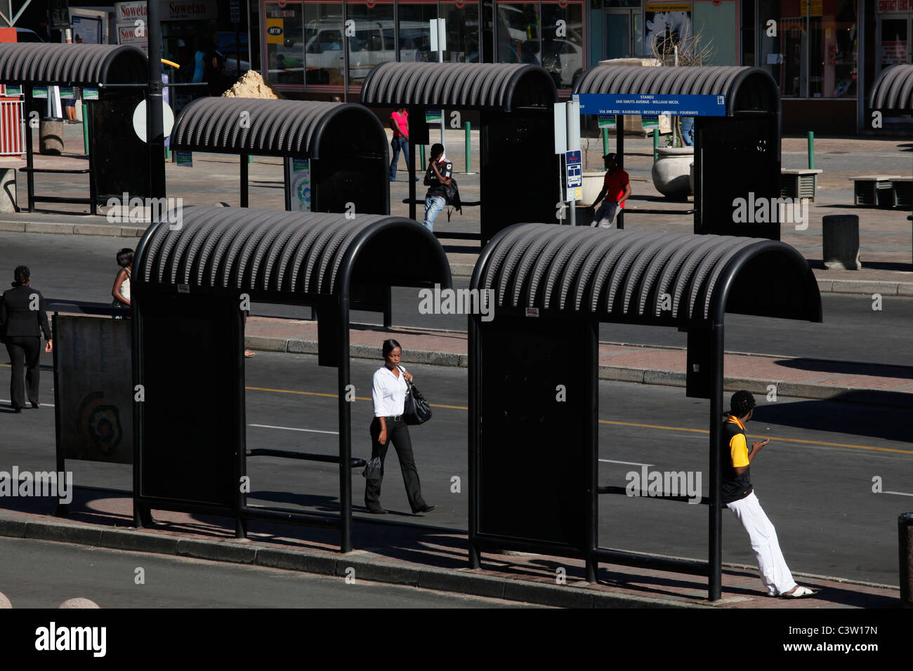 Commuters walk through an empty bus station in Ghandi Square, CBD ...
