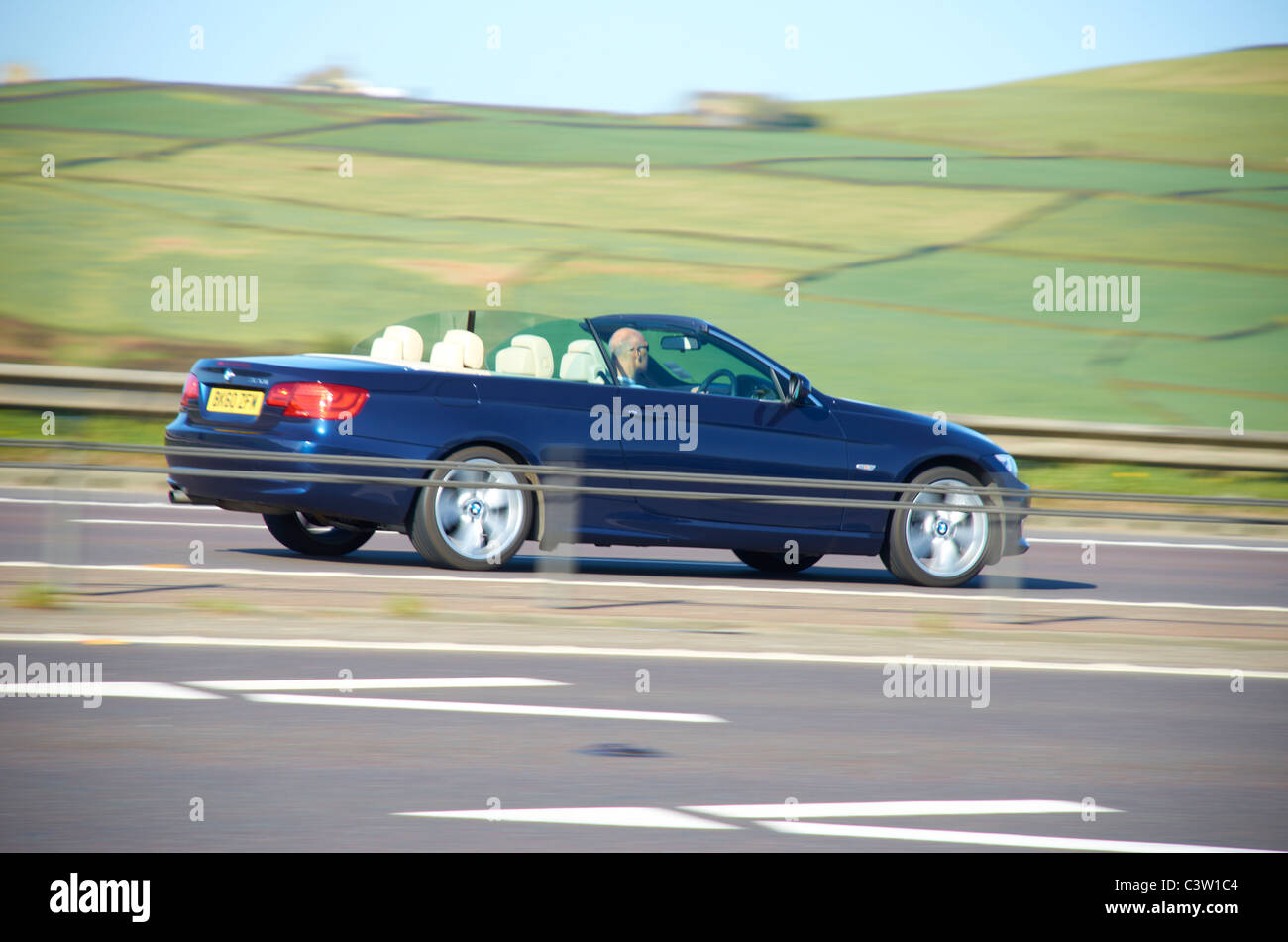 Open top car on the motorway Stock Photo - Alamy