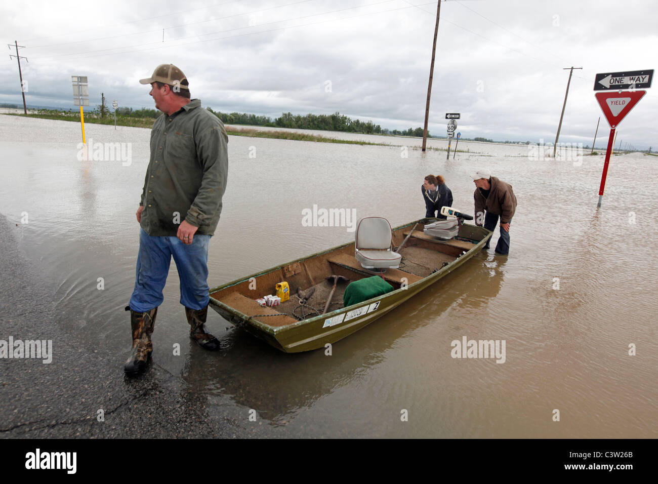 Residents navigate by fishing boat through severely flooded US Highway ...