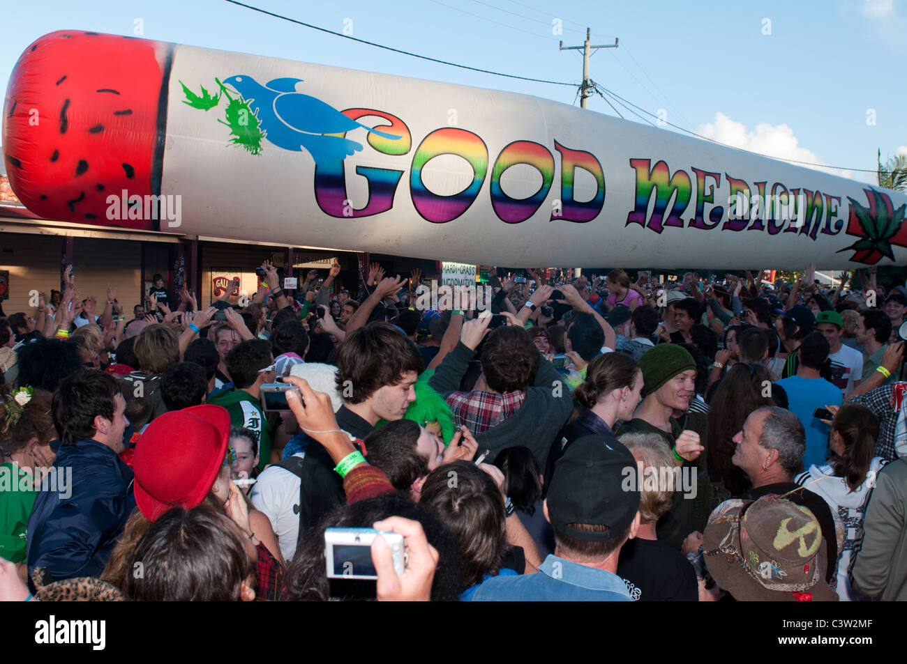 Large inflatable marijuana joint and crowd during Nimbin's MardiGrass ...