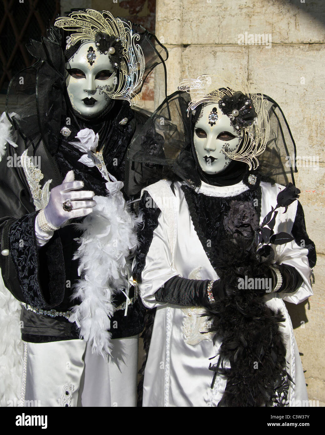 Harlequin style costumes during Carnival Stock Photo - Alamy