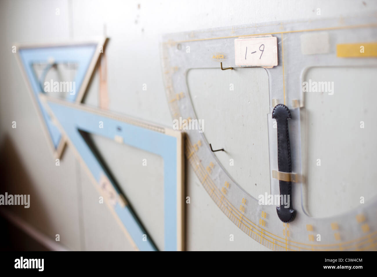 Triangular and Angle Rulers on Wall Stock Photo - Alamy
