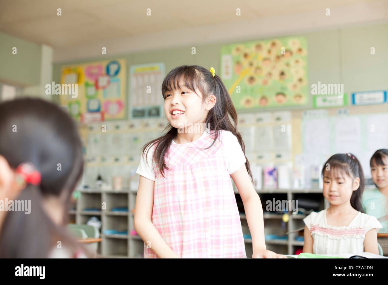 Woman Answering in Classroom Stock Photo - Alamy