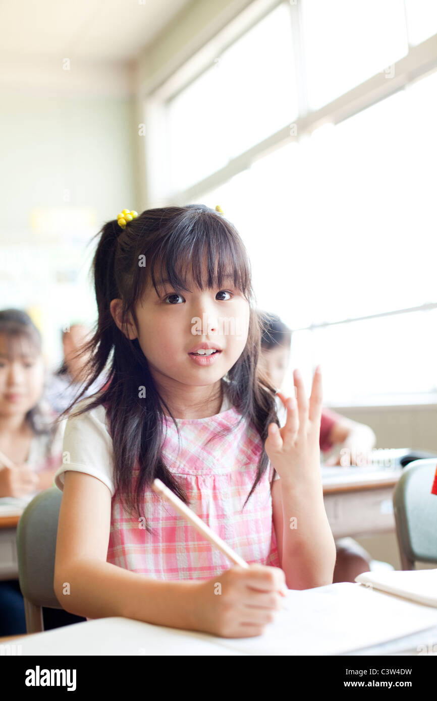 Schoolgirl Calculating in Classroom Stock Photo - Alamy