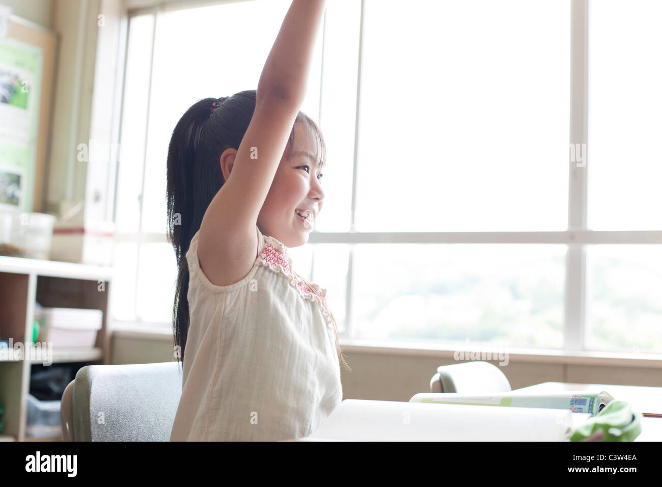 Girl Rising Hand School High Resolution Stock Photography and Images ...