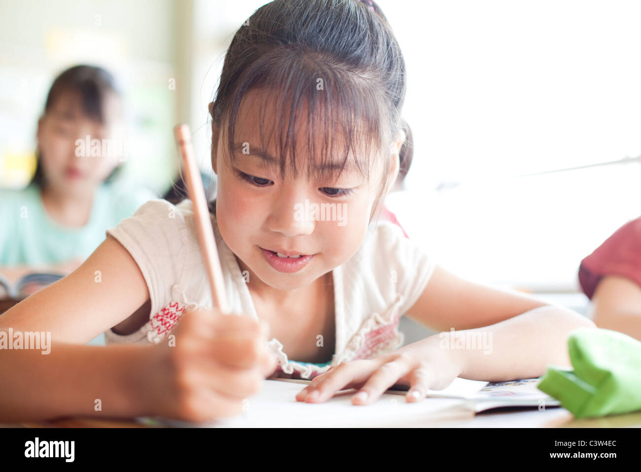 Girl Studying in Classroom Stock Photo - Alamy