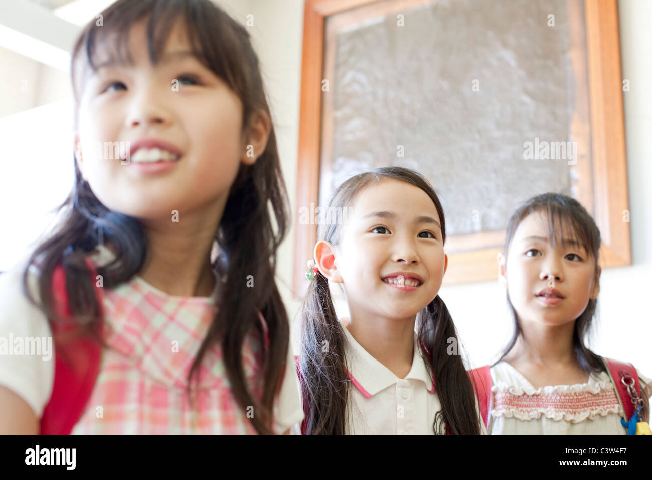 Three school girls hi-res stock photography and images - Alamy