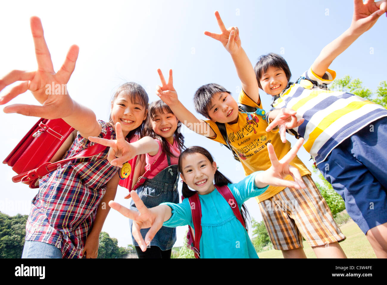 Five Schoolchildren Doing Peace Sign Stock Photo - Alamy