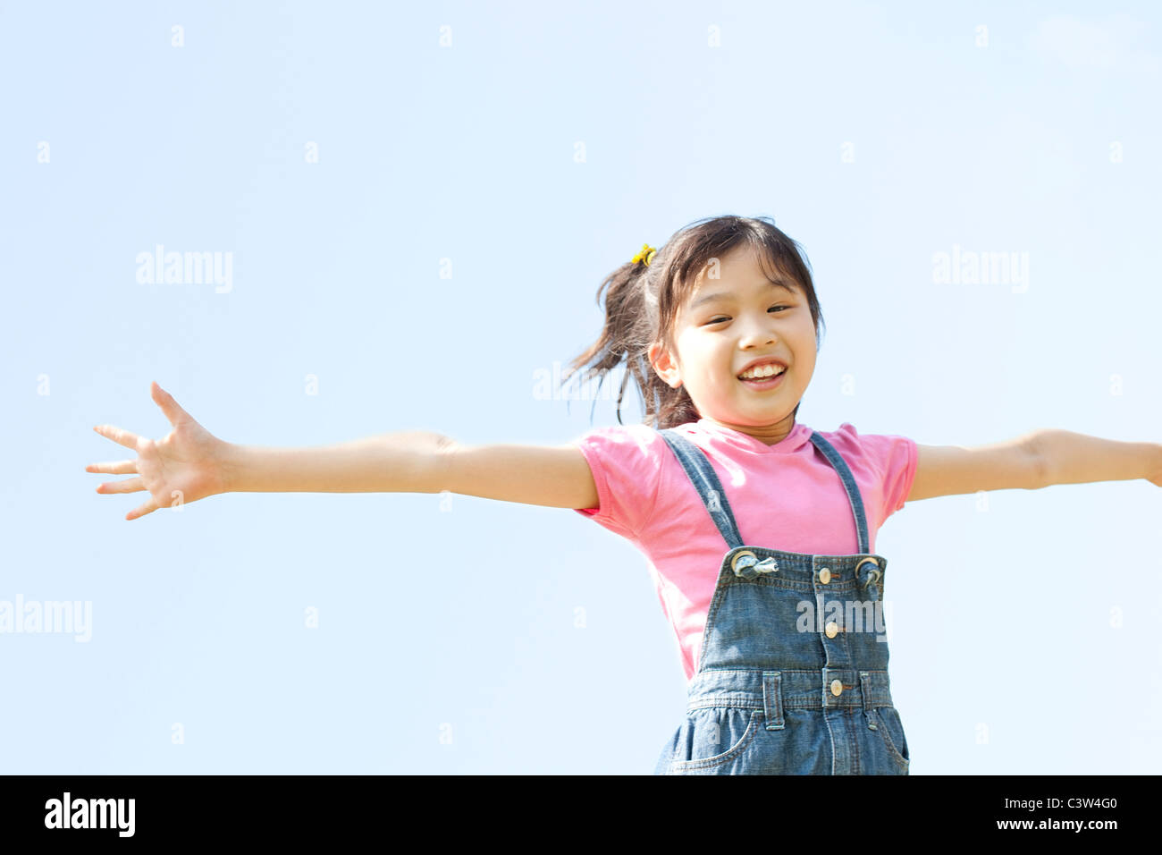 Girl Spreading Arms Stock Photo - Alamy