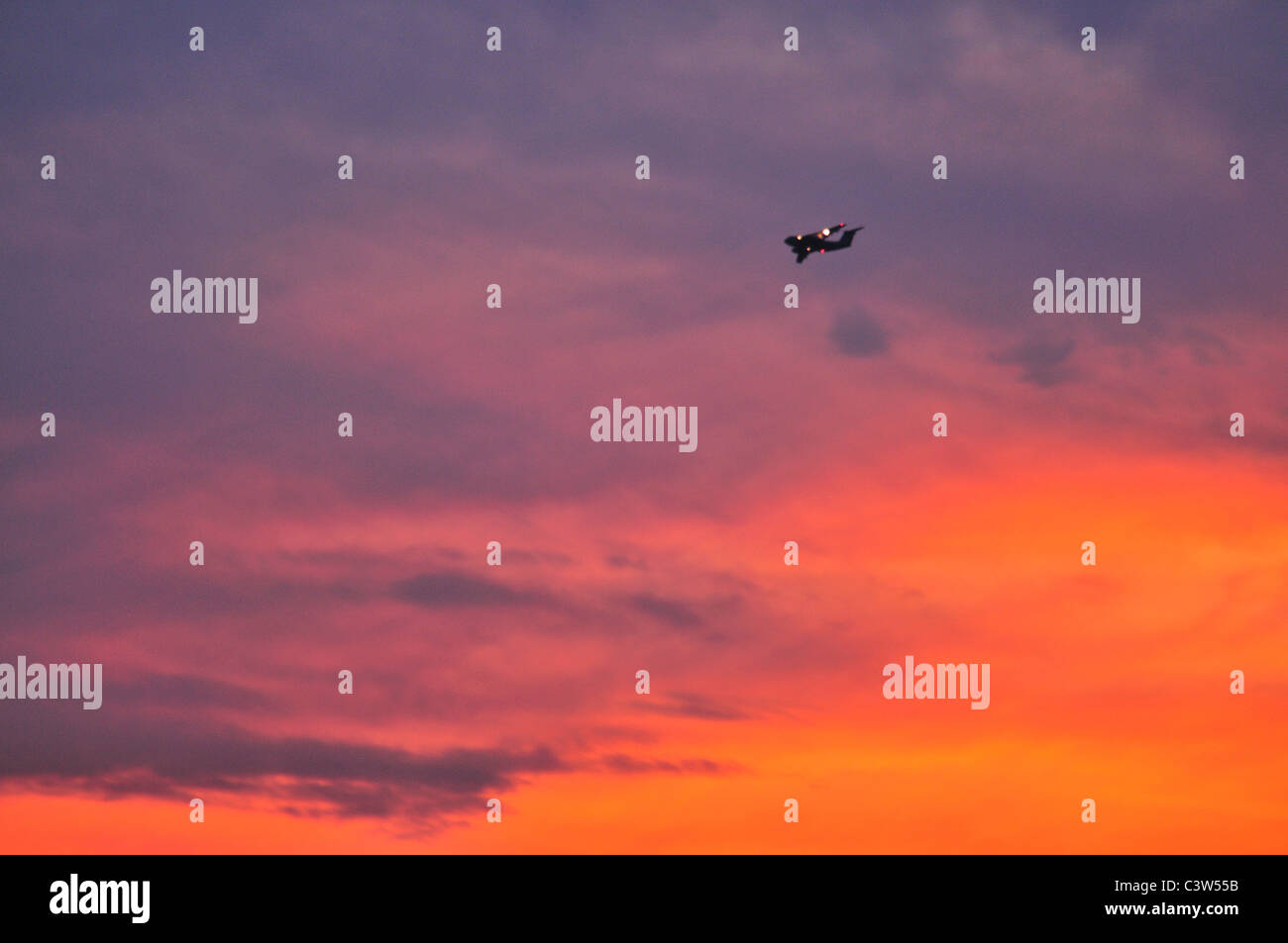 Airplane in Sunset Stock Photo - Alamy