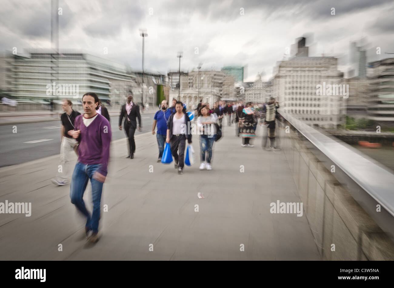 People walking over London Bridge Stock Photo - Alamy