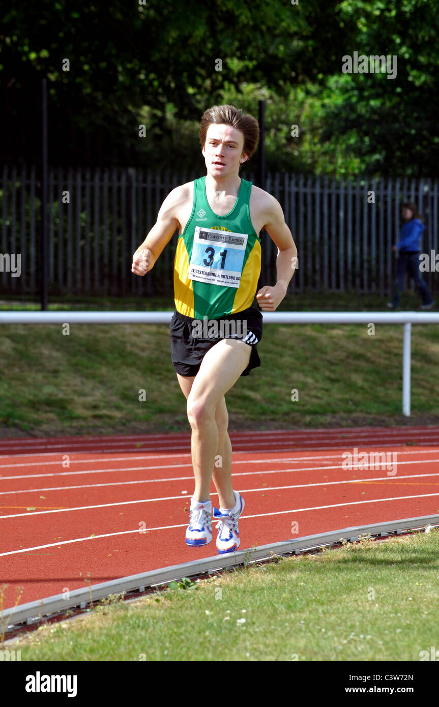 Runner in men`s 1500m track race Stock Photo - Alamy
