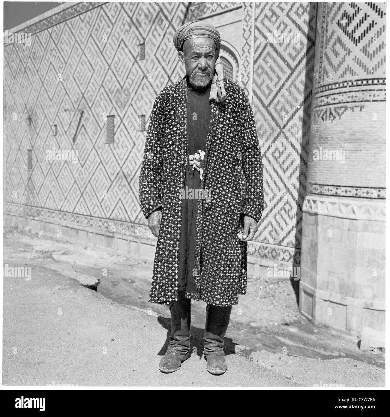 A portrait from the 1950s, of an elderly uzbek wearing traditional ...