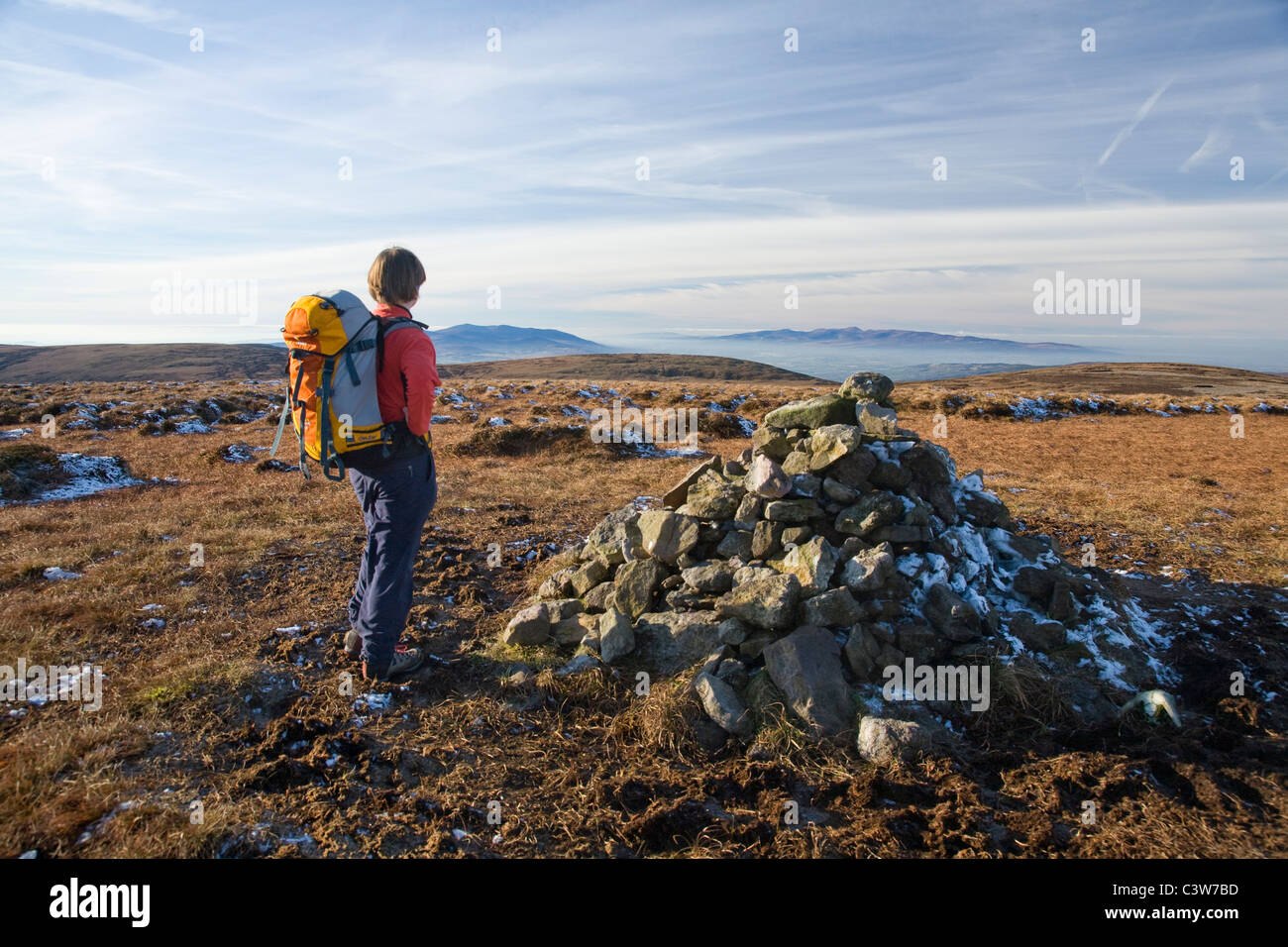 Walker at the highest point of the Comeragh Mountains, County Waterford ...