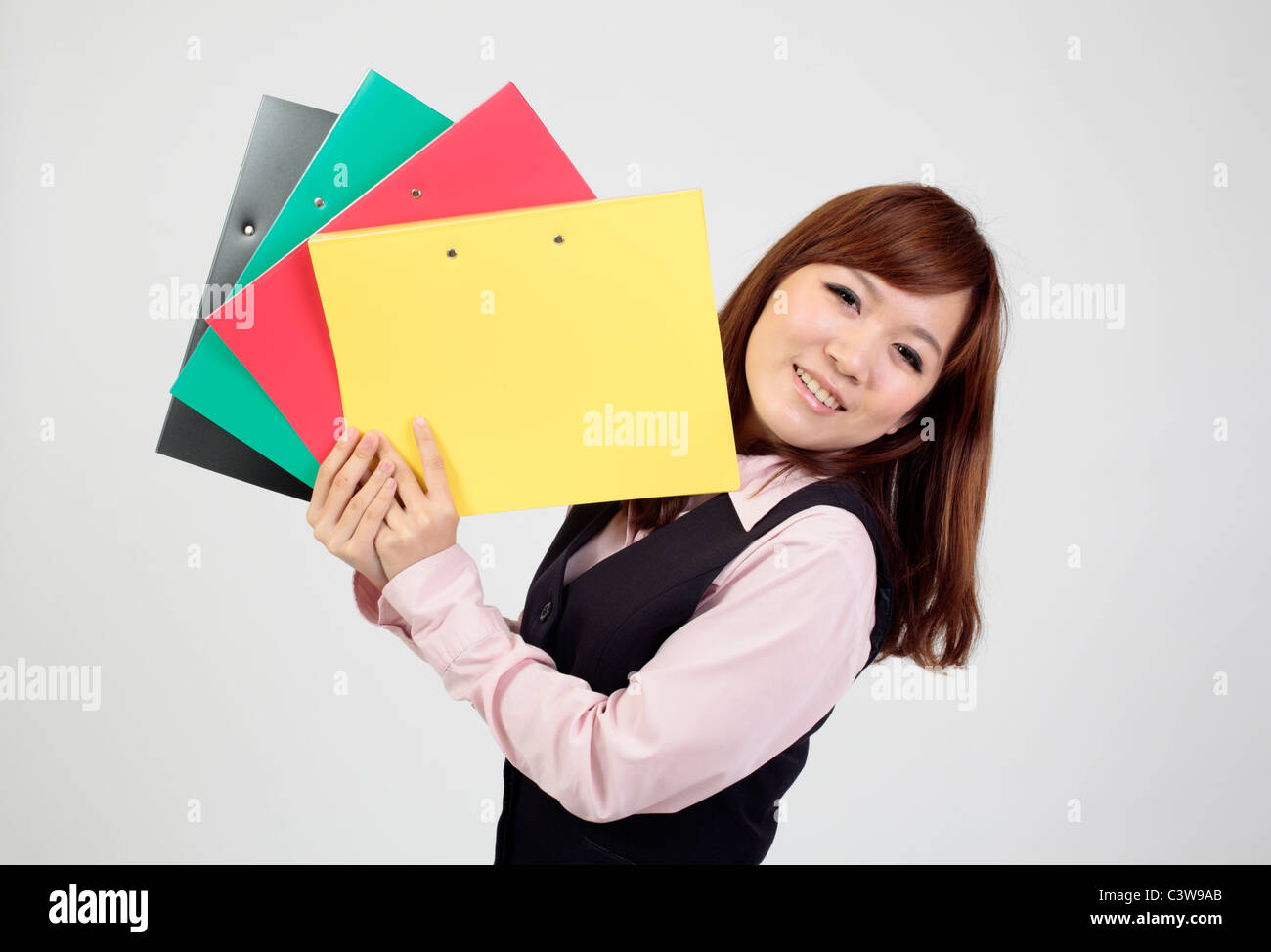 Office lady holds colorful files Stock Photo - Alamy
