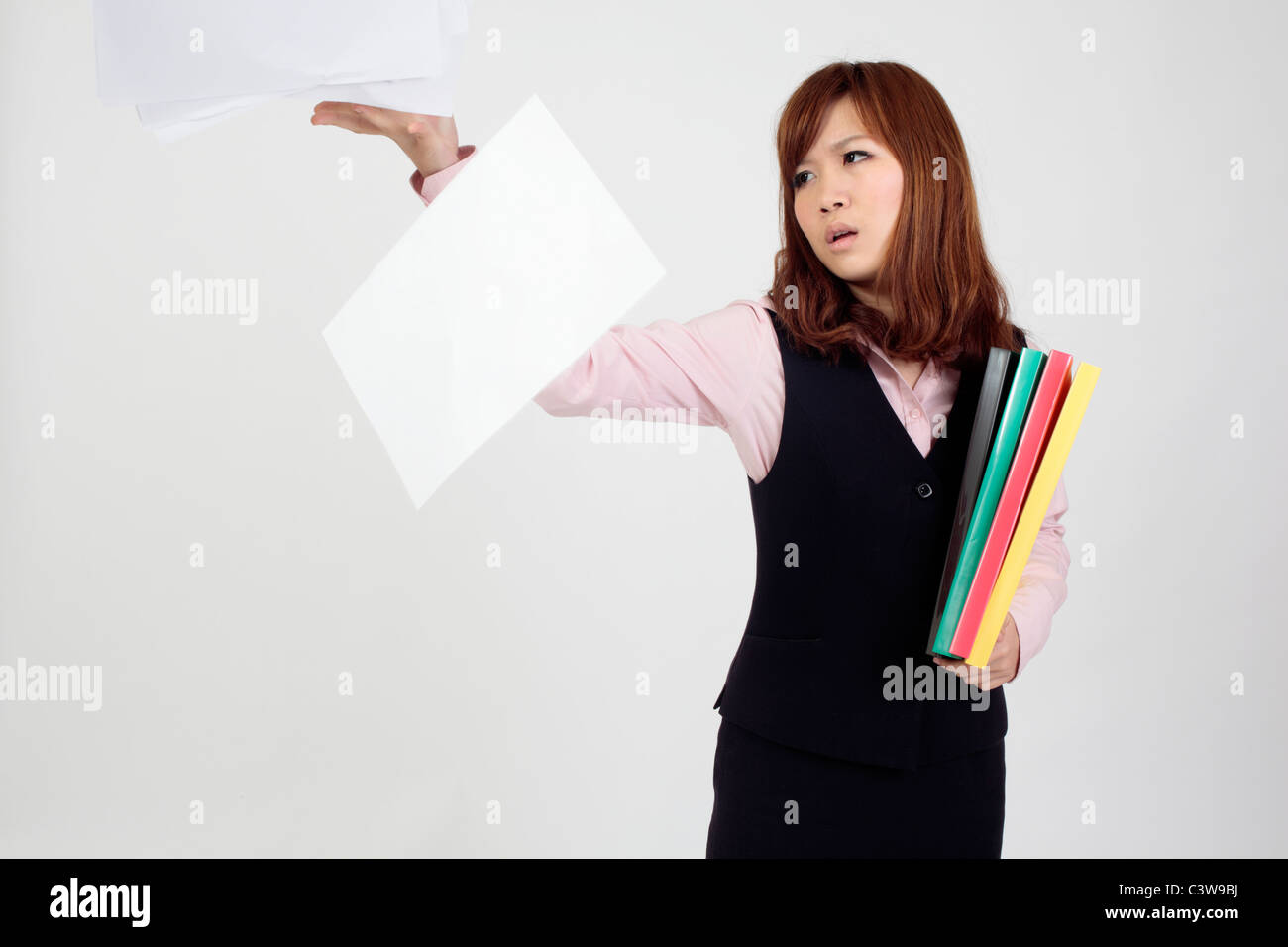 Office lady throws papers Stock Photo - Alamy