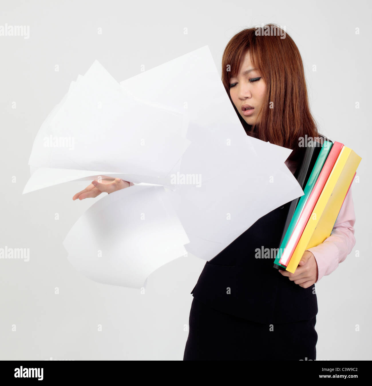 Office lady throws papers Stock Photo - Alamy