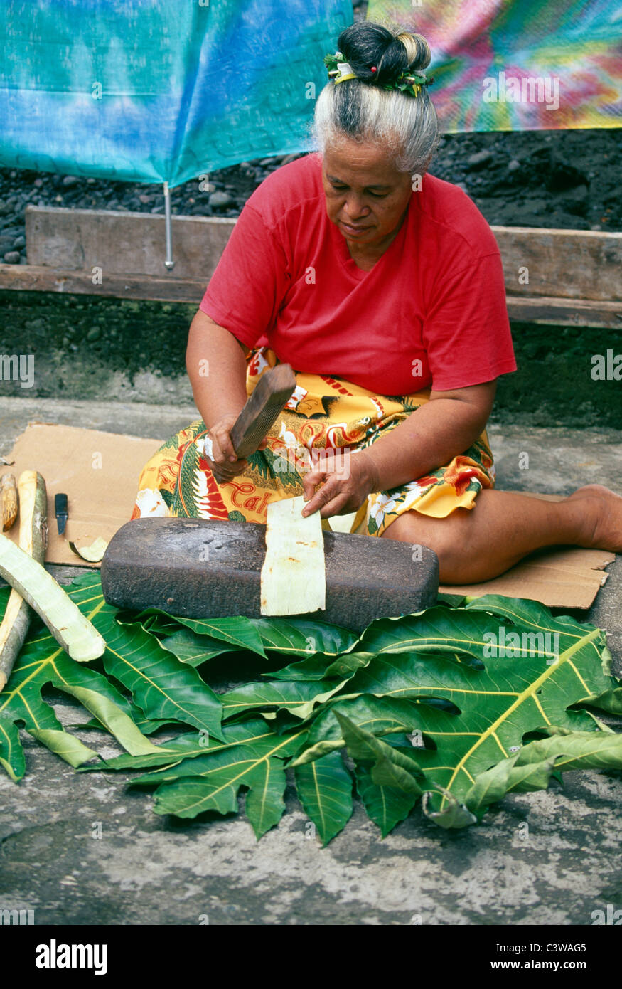NATIVE WOMAN POUNDING TAPA, INNER BARK OF PAPER MULBERRY, ON FATU HIVA ...