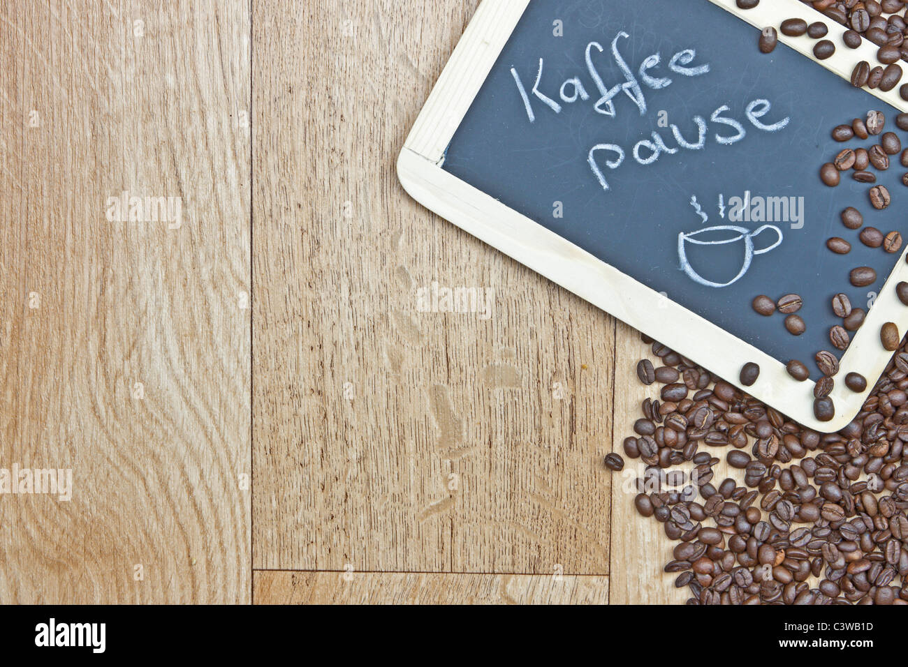 Coffee beans on wood with a chalkboard and the symbol for a Coffee ...