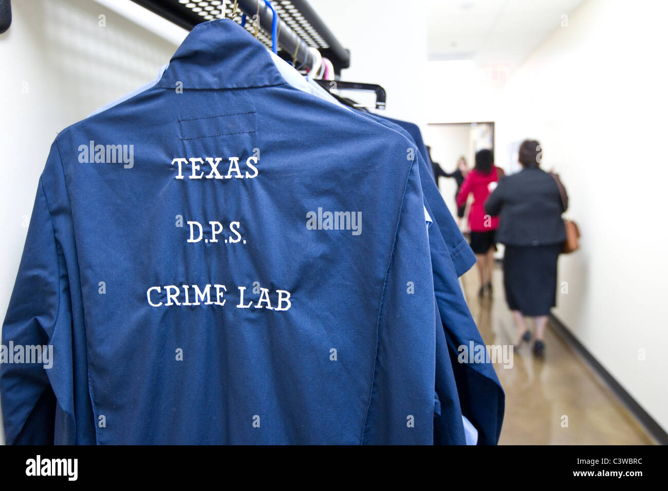 A Texas Department of Public Safety Crime lab coat hangs in a hallway ...