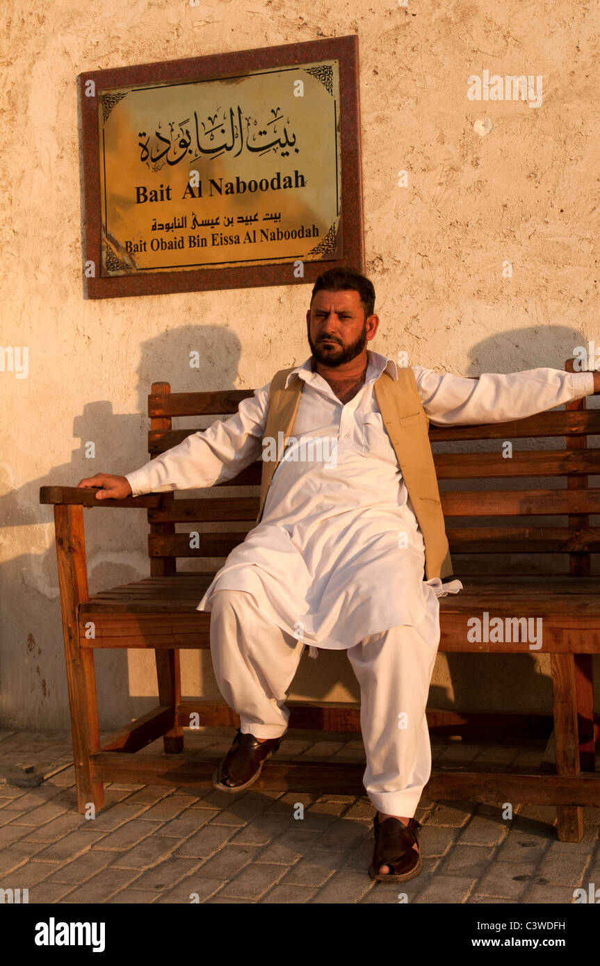 Relaxed Arab man on a bench Stock Photo - Alamy