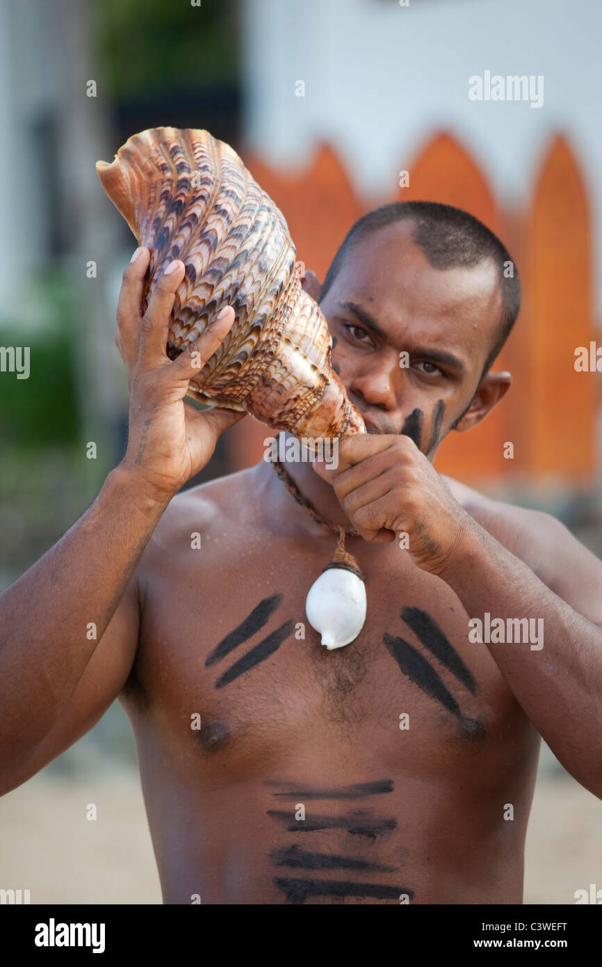 Conch shell blowing hi-res stock photography and images - Alamy
