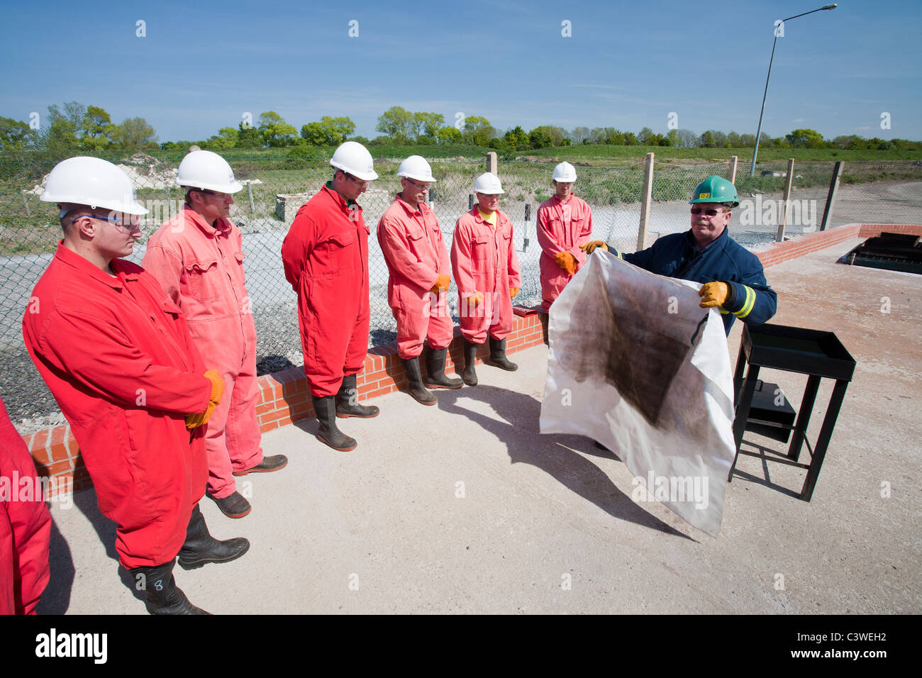 Workers in the offshore industry practice fire fighting as part of an ...