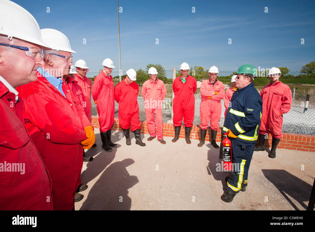 Workers in the offshore industry practice fire fighting as part of an ...