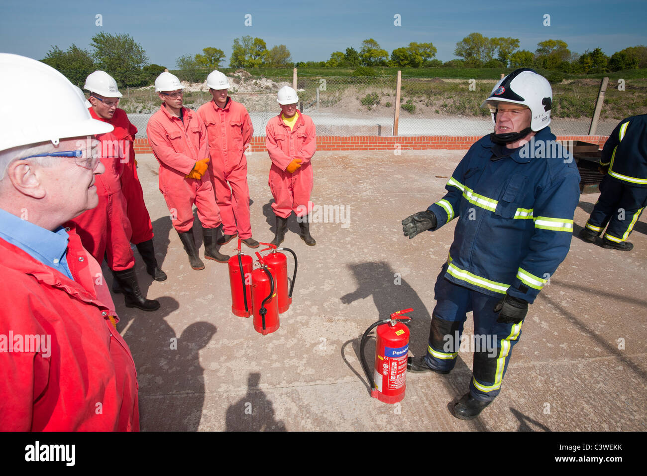 Workers in the offshore industry practice fire fighting as part of an ...