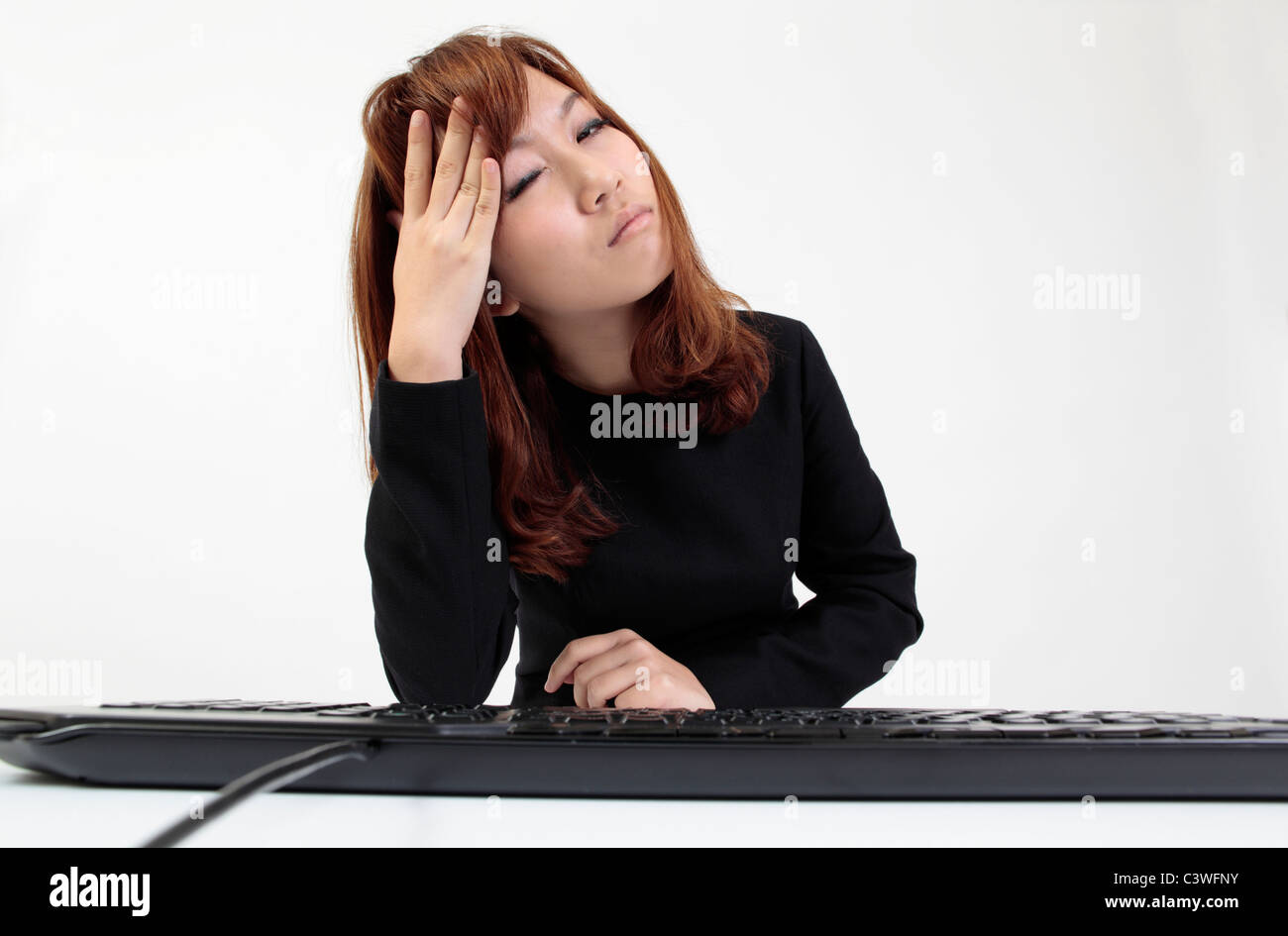 Office lady uses keyboard Stock Photo - Alamy