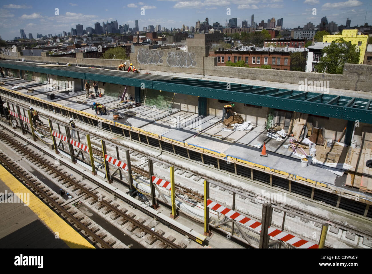 Workers renovate the 4th Ave elevated subway station on the F Line with ...