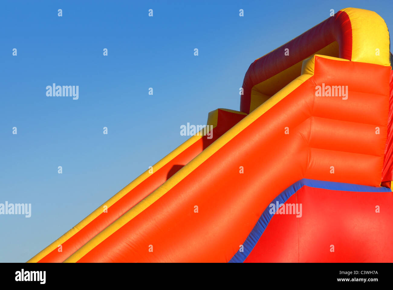 View colorful inflatable blow-up toy on blue sky background Stock Photo ...